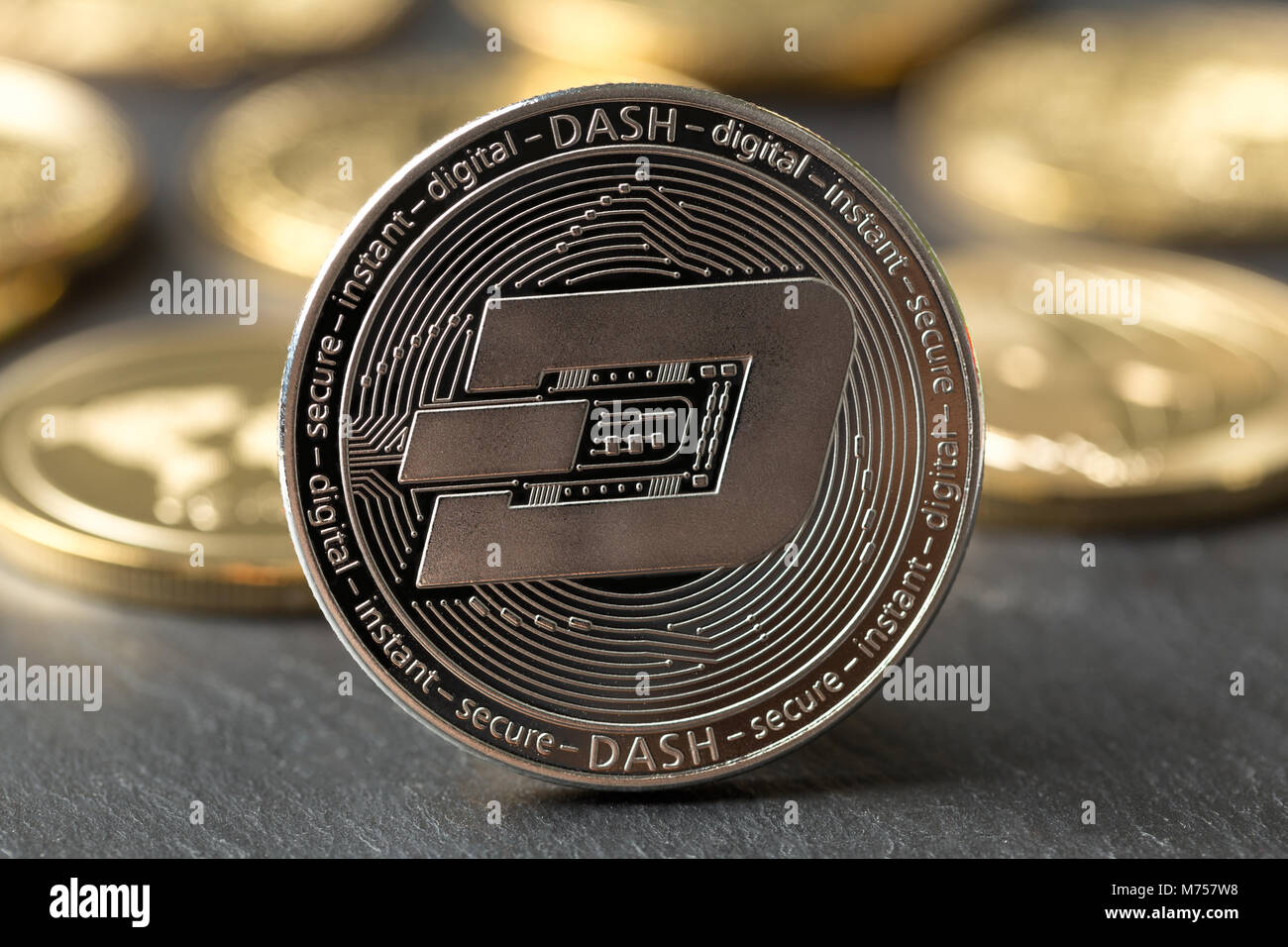 dash crypto coin on a slate background Stock Photo - Alamy