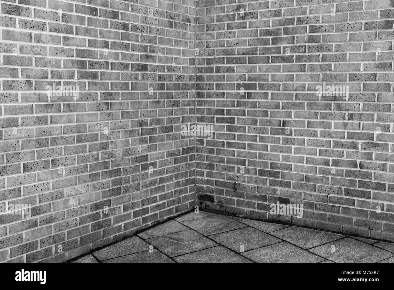 Abstract black and white image of walls converging into corner. For ...