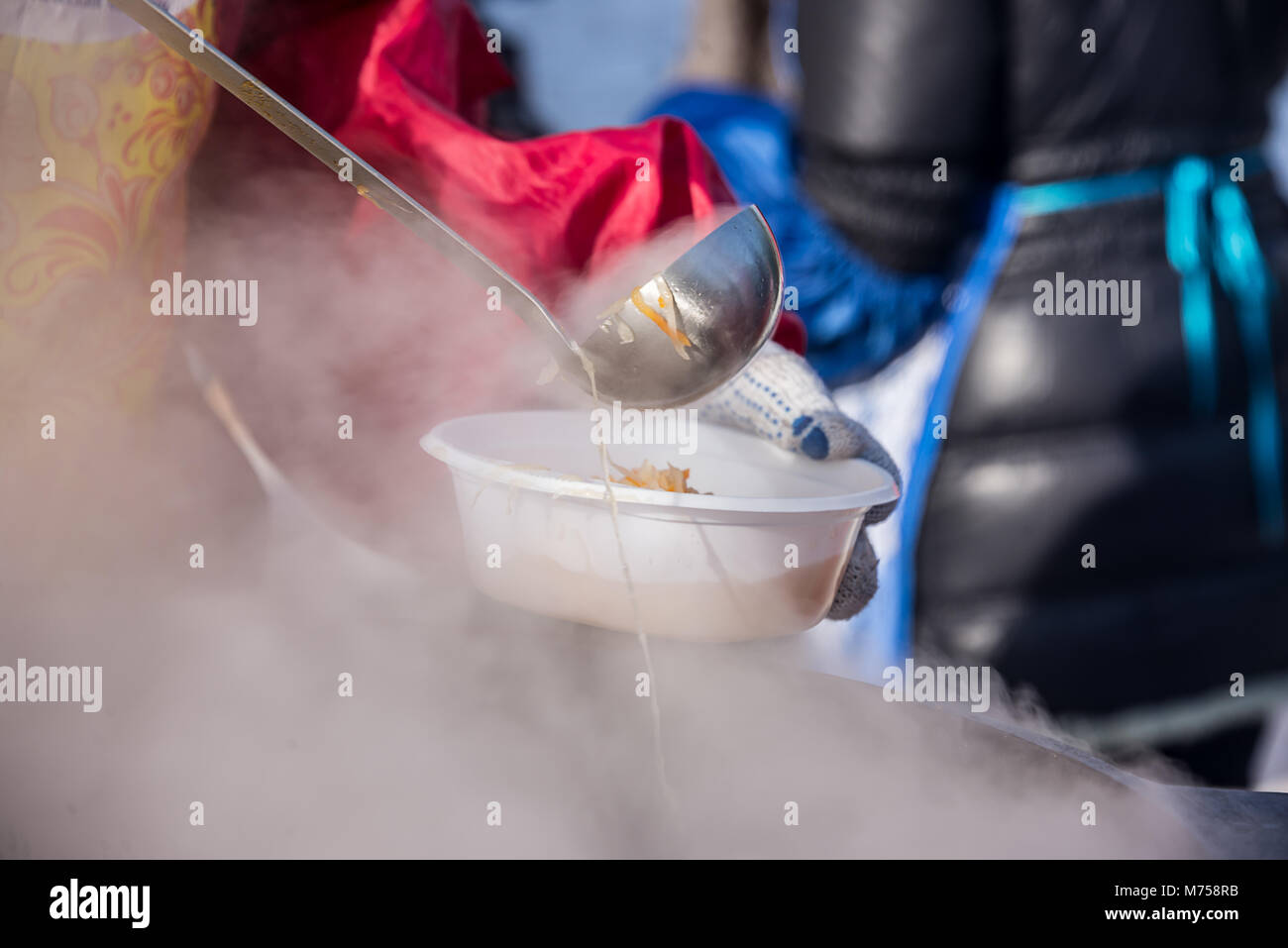 feeding homeless people on the street, social problems, hungry people ...