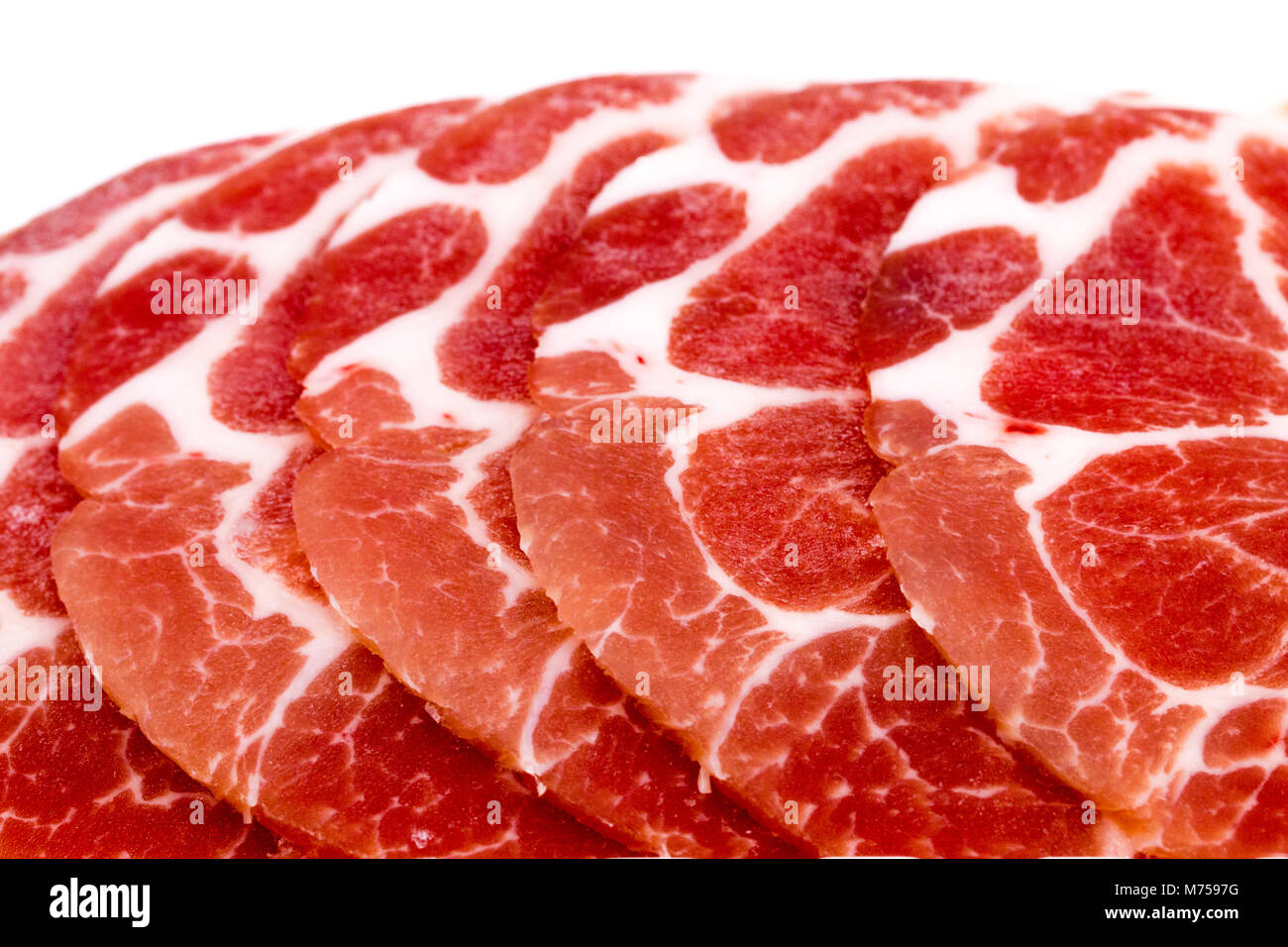 Close-up sliced raw pork isolated on white background. It copy space ...