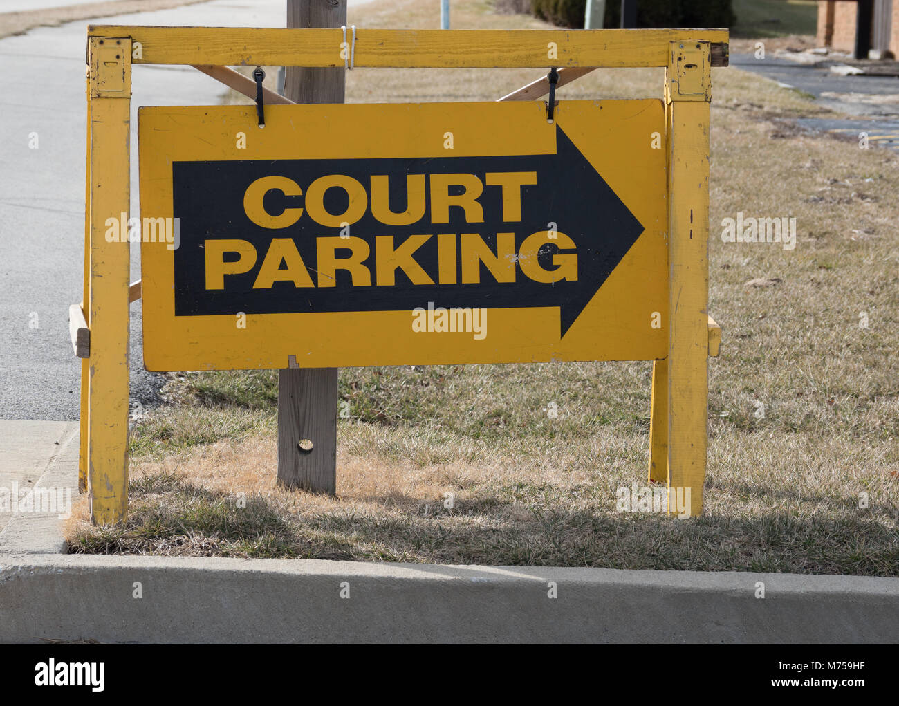 Sign directing to court parking Stock Photo - Alamy