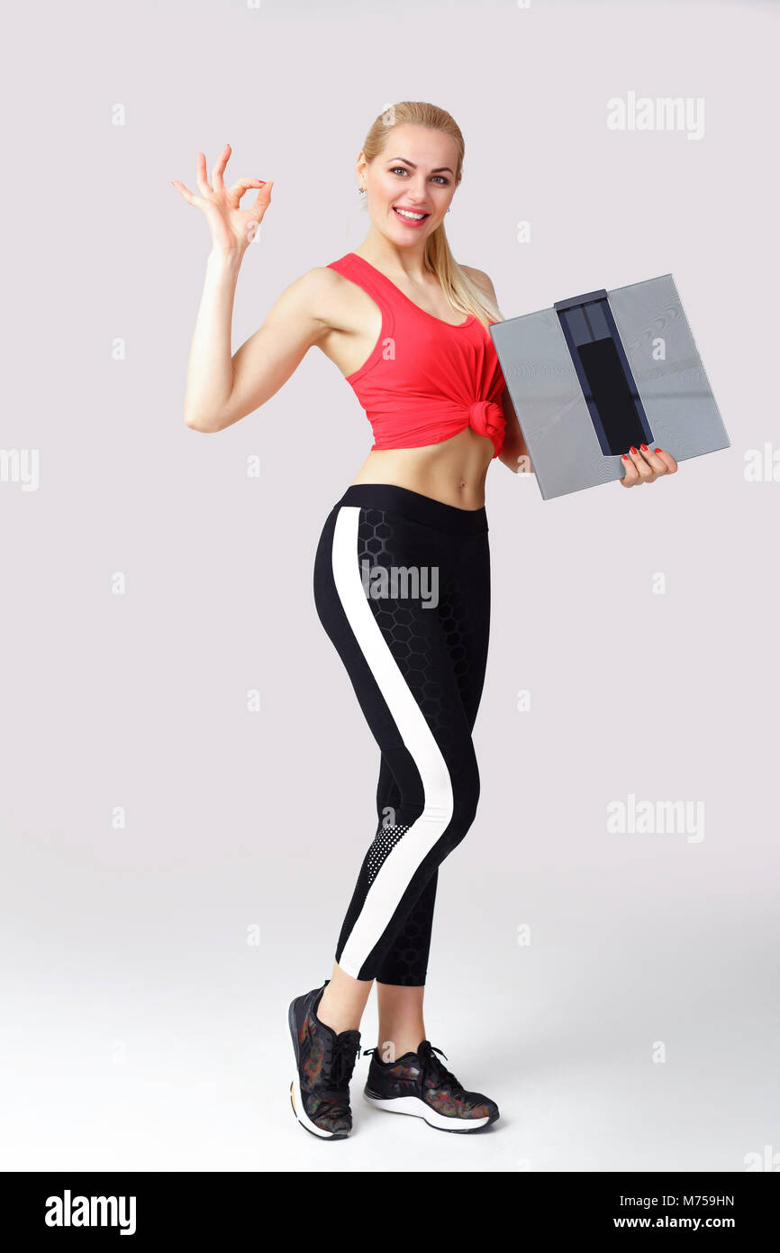Big woman scales hi-res stock photography and images - Alamy