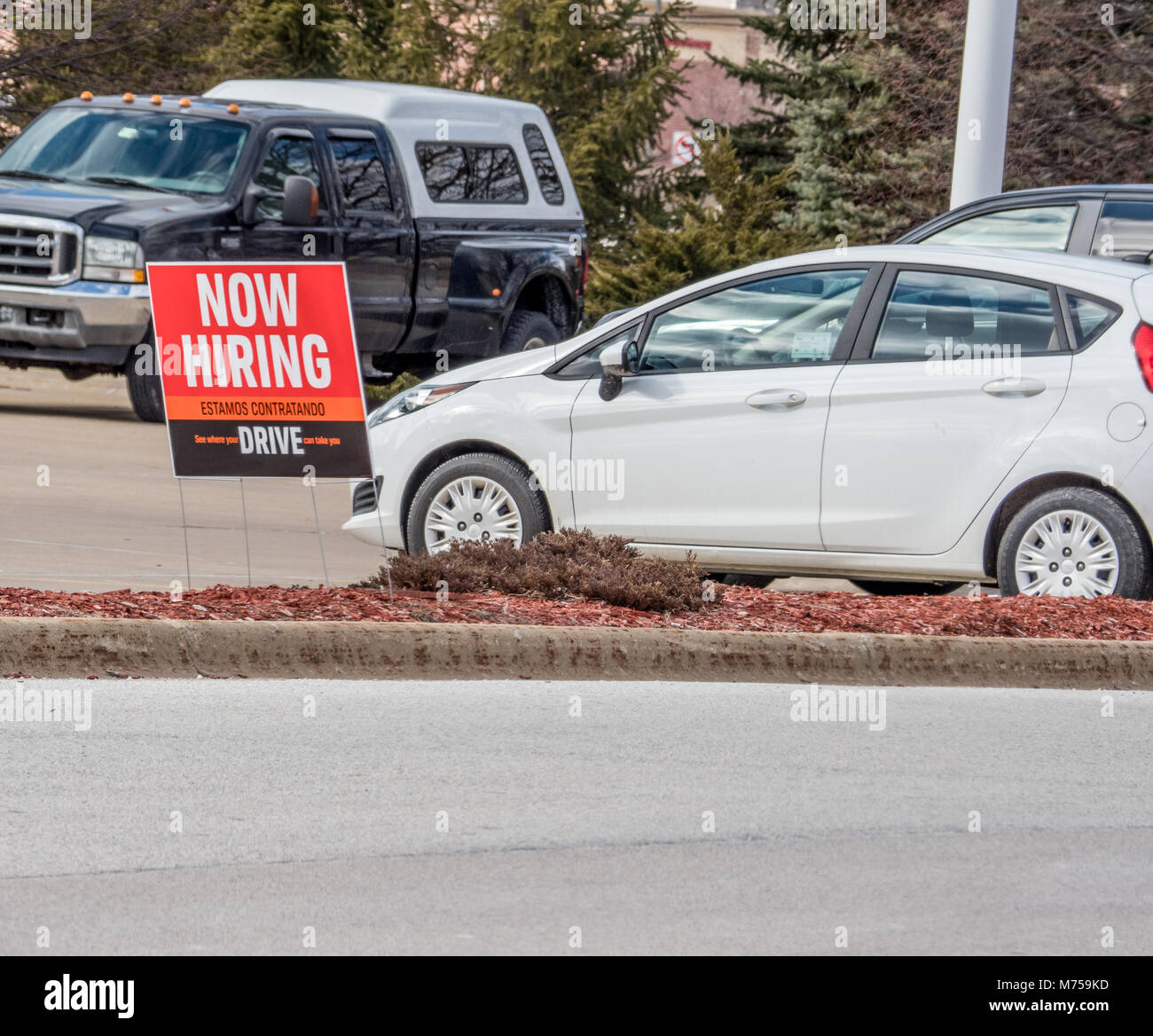 Roadside "Now Hiring" sign Stock Photo - Alamy