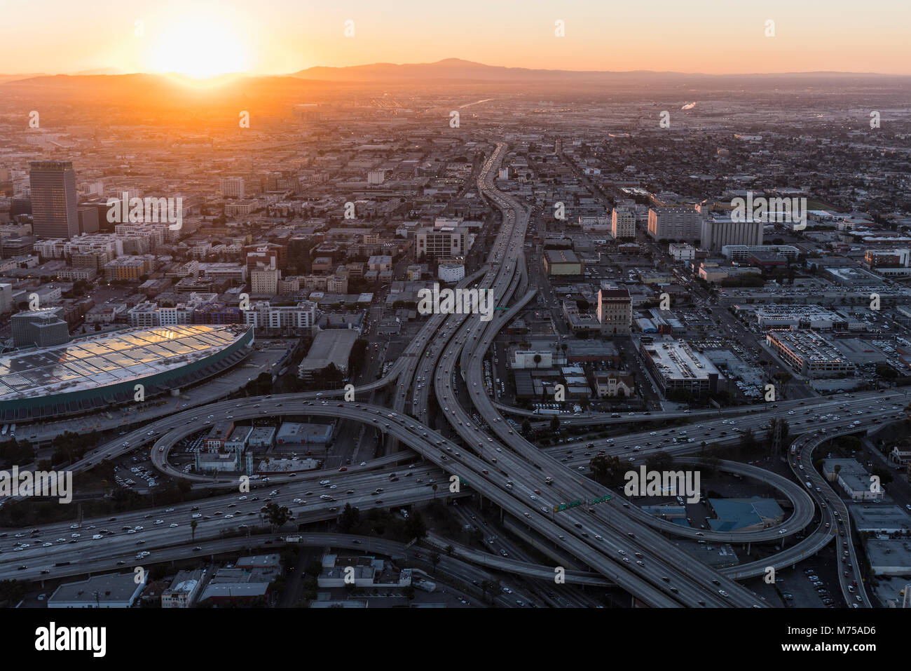 Aerial sunrise view of 10 and 110 freeway interchange ramps in downtown ...