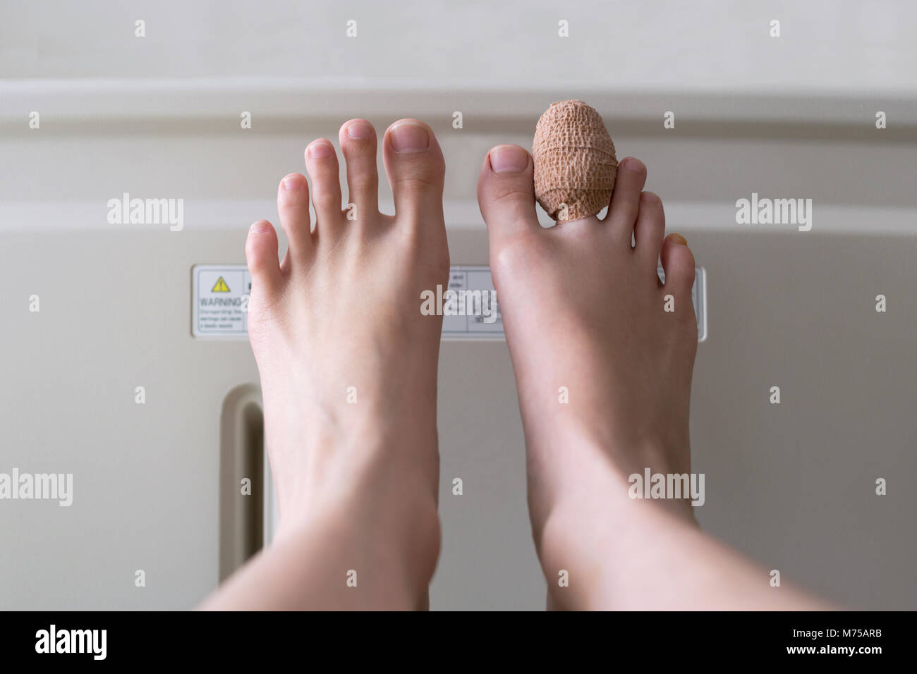 close up of bandage index toe of the female patient sleeping in the ...