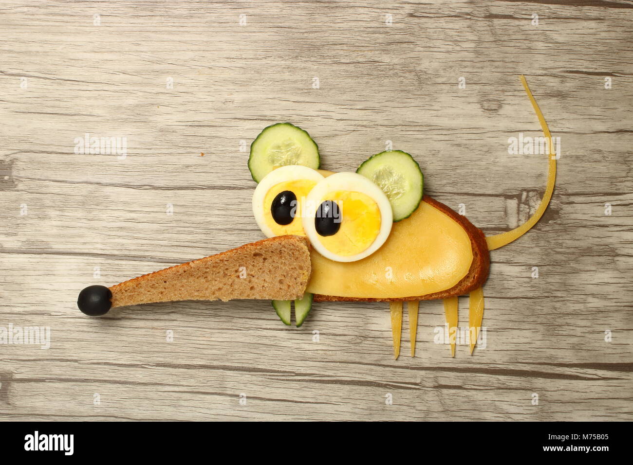Mouse made with food ingredients on wooden background Stock Photo - Alamy