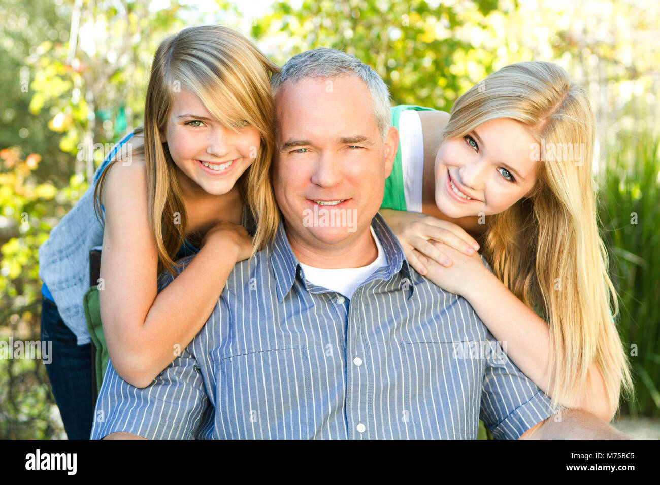 Happy family smiling Stock Photo - Alamy