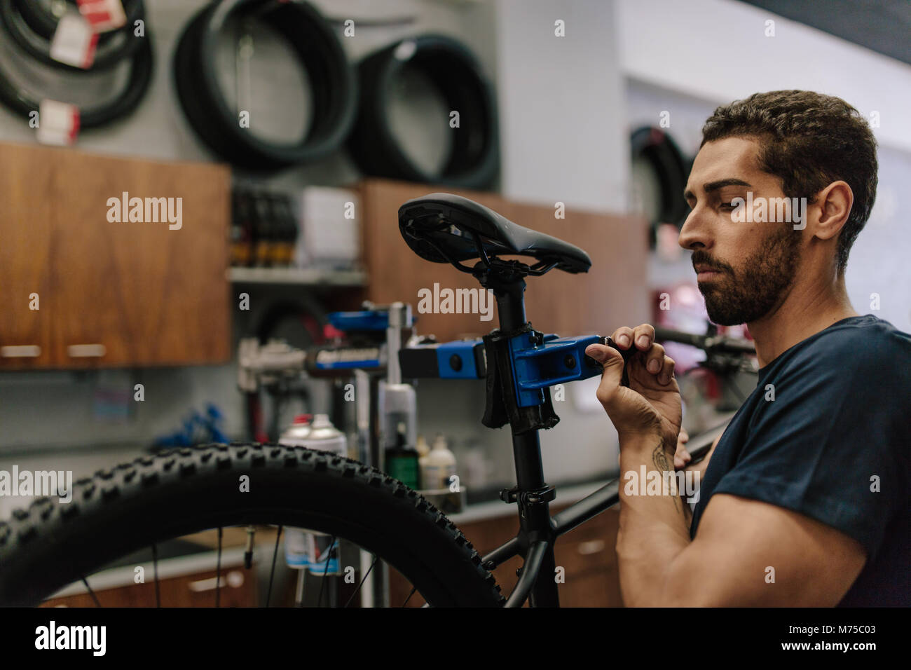 Repairing a bicycle hi-res stock photography and images - Alamy