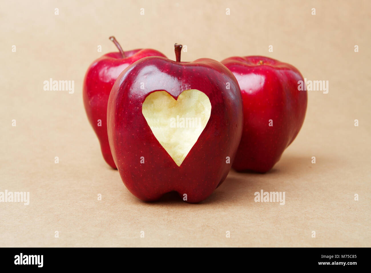 Apple with a heart Stock Photo - Alamy