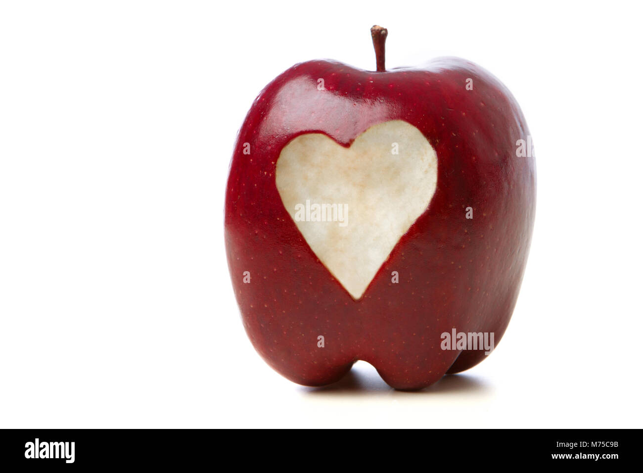 Apple with a heart Stock Photo - Alamy