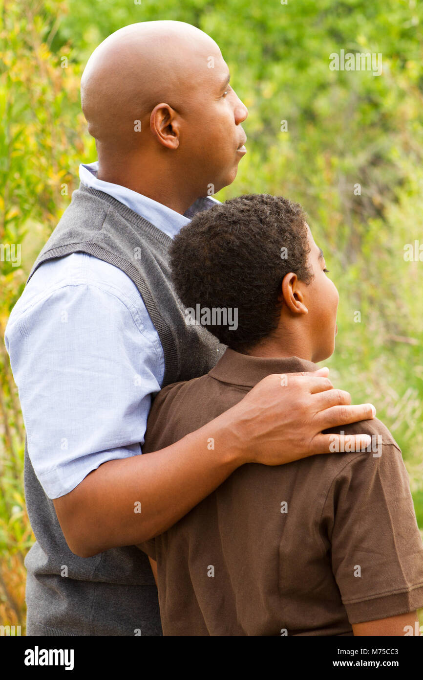 Father comforting his son Stock Photo - Alamy