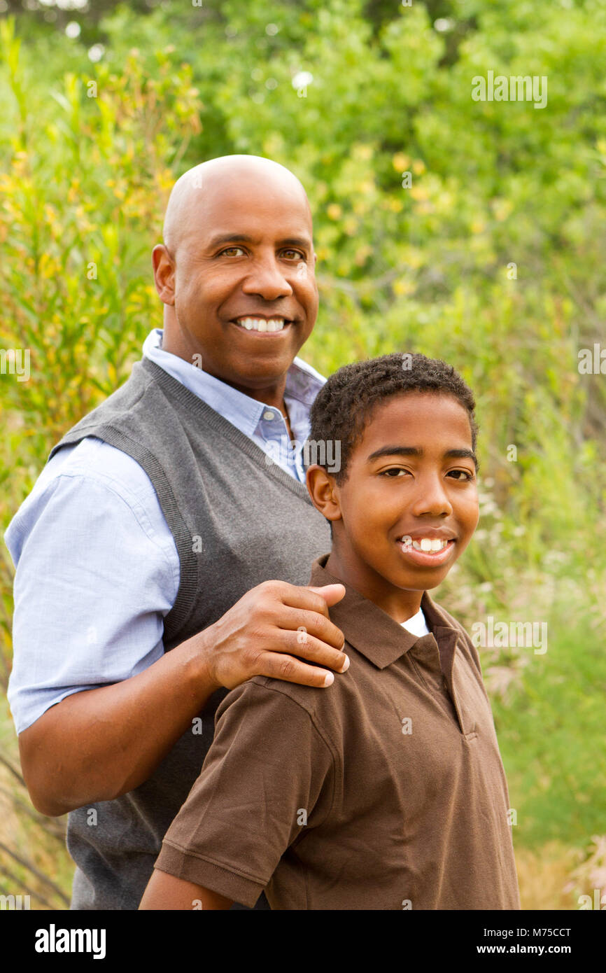 African American father and son talking and laughing Stock Photo - Alamy