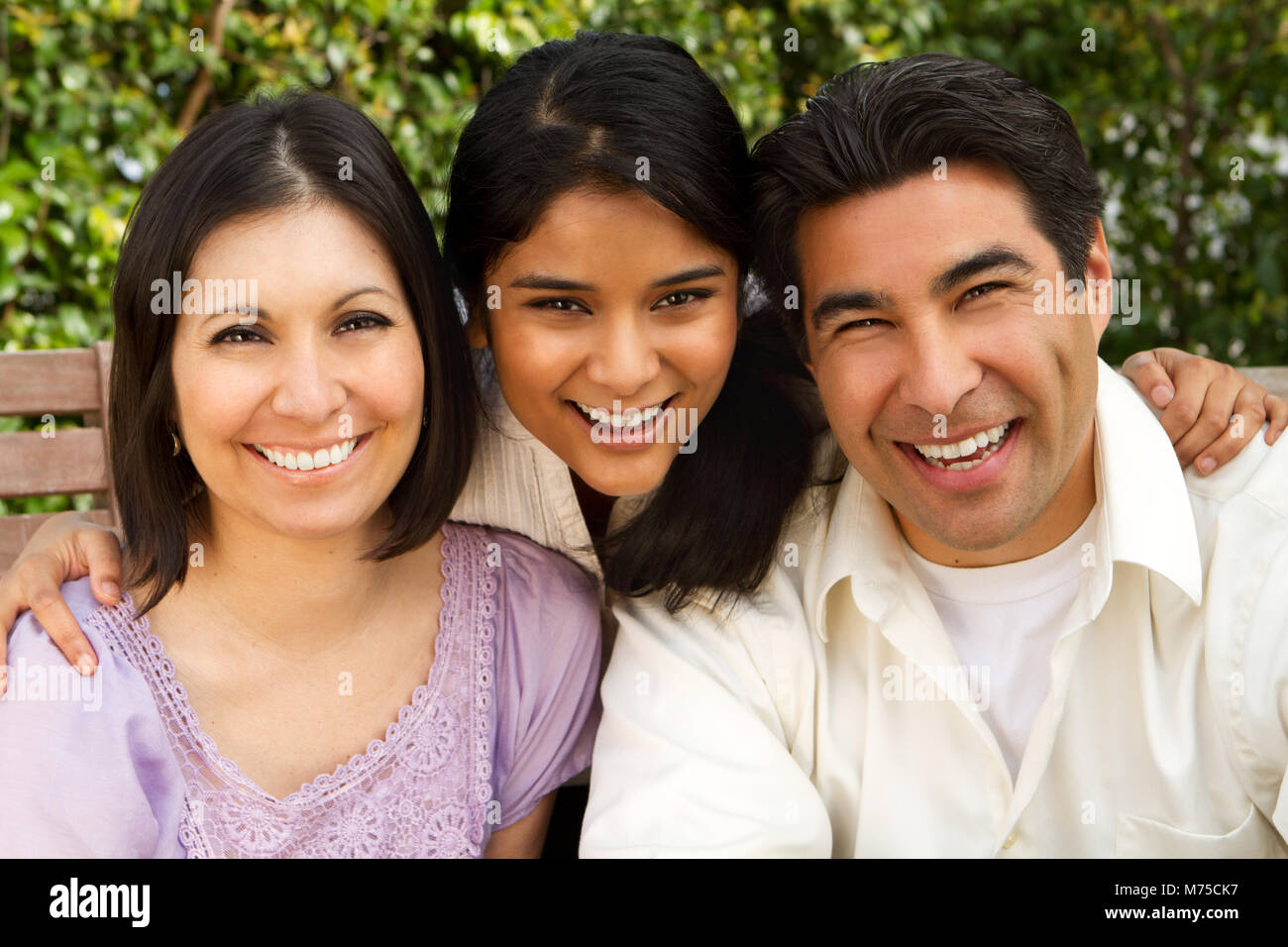 Hispanic family with a teen daughter Stock Photo - Alamy