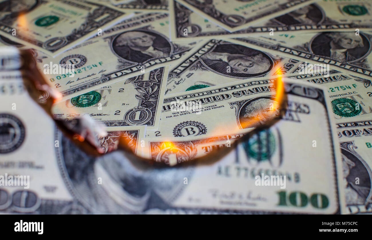 Burning dollar bill hi-res stock photography and images - Alamy