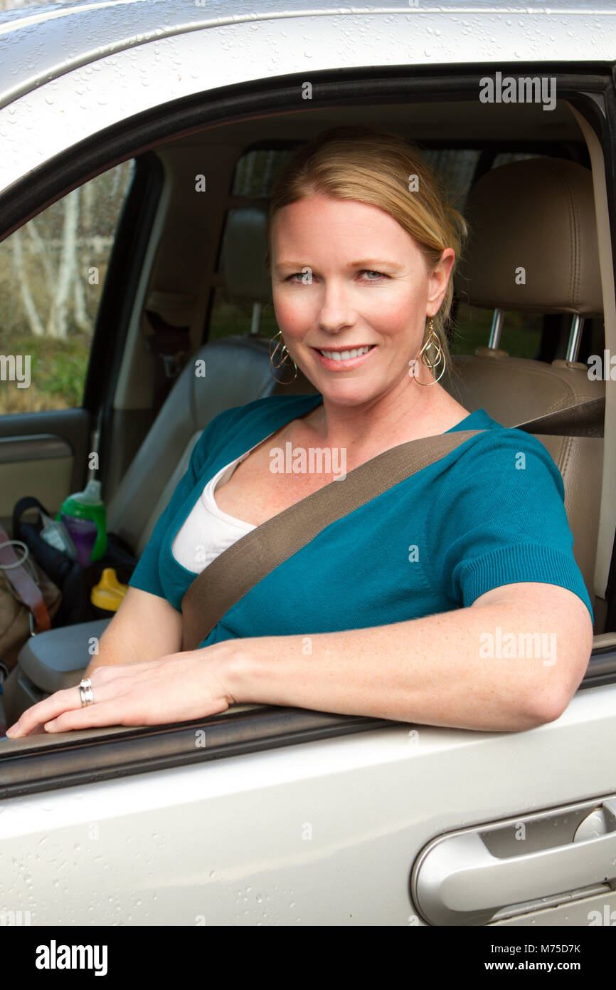 Happy woman driving Stock Photo - Alamy