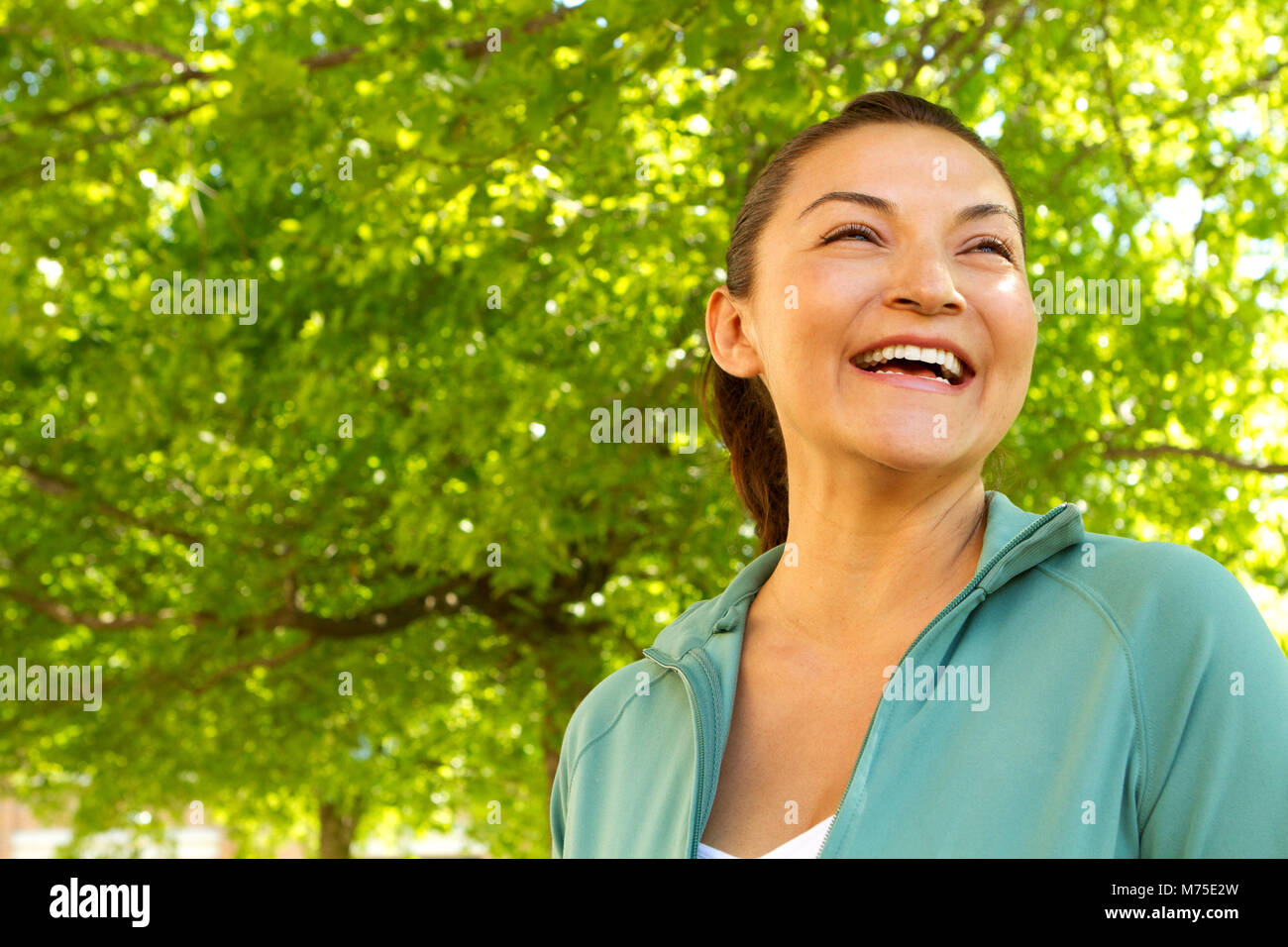 Happy Hispanic woman smiling Stock Photo - Alamy