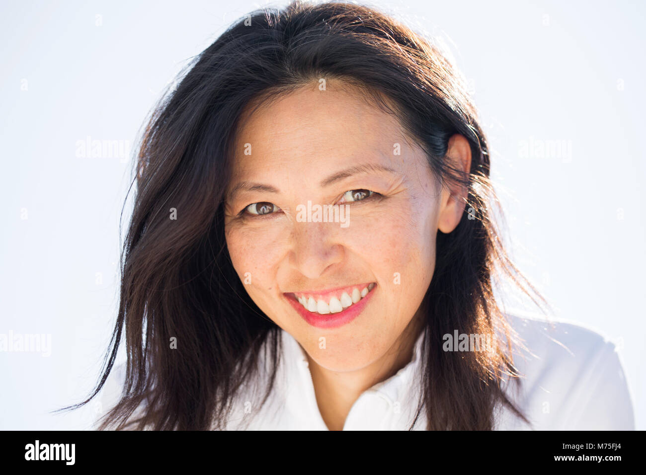 Portrait of an Asian woman smiling Stock Photo - Alamy