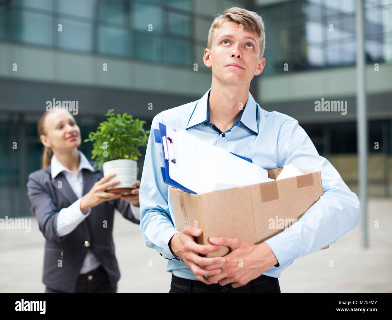 Businessman is standing happy near office because he leave bad job ...