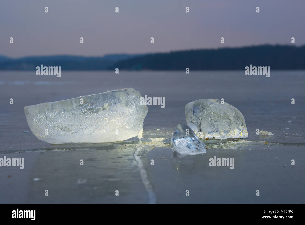 Frozen lake. Reflection of sun rays in flat ice on the lake. Air ...