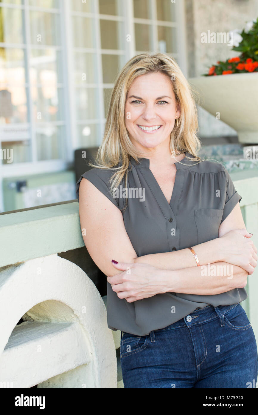 Confident woman smiling hi-res stock photography and images - Alamy