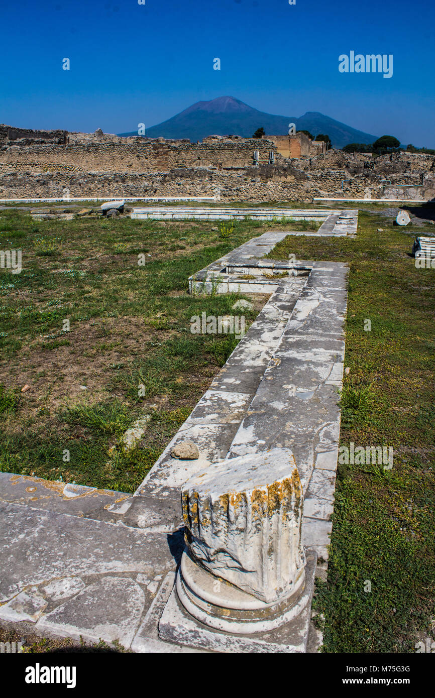 Remains of a column and building with Mount Vesuvius behind, Pompeii ...