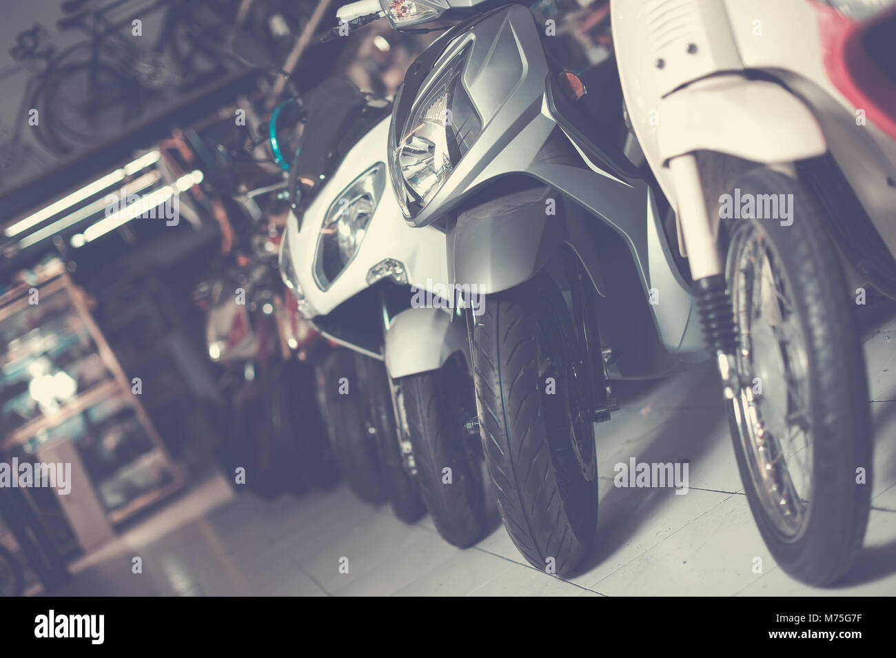Image of modern different colors motorbikes selling in the shop Stock ...