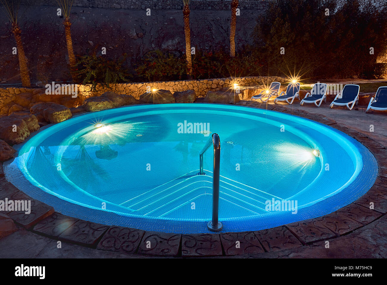 Elegant empty water pool with blue water at night Stock Photo - Alamy