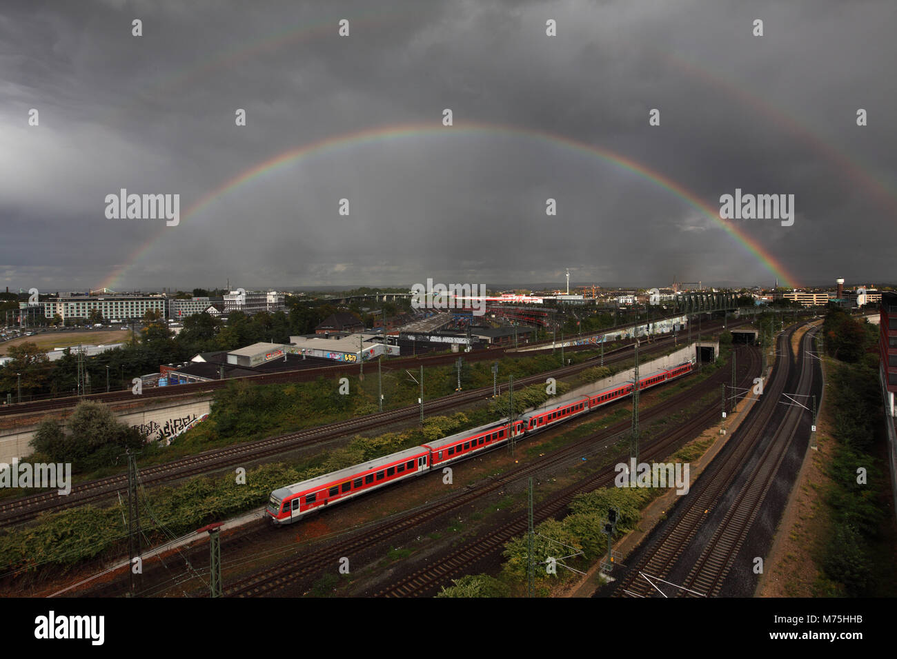 Rainbow over German S-Bahn Train in Cologne Stock Photo - Alamy