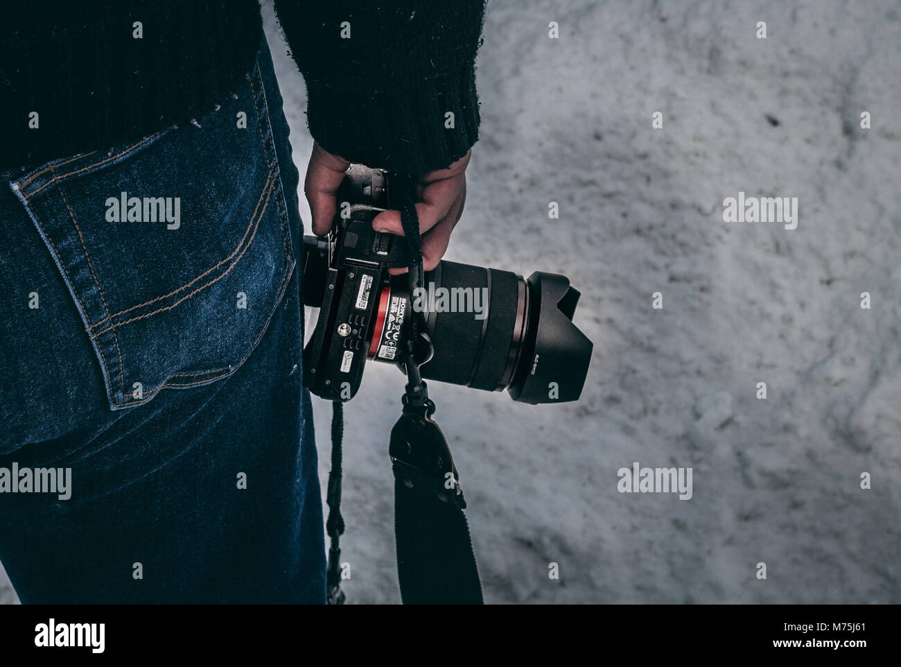 Man Holding a Camera Stock Photo - Alamy