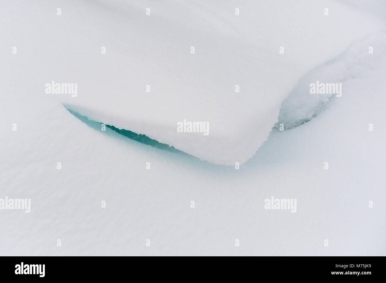 Snow falling on a beautiful texture of broken pieces of ice Stock Photo ...