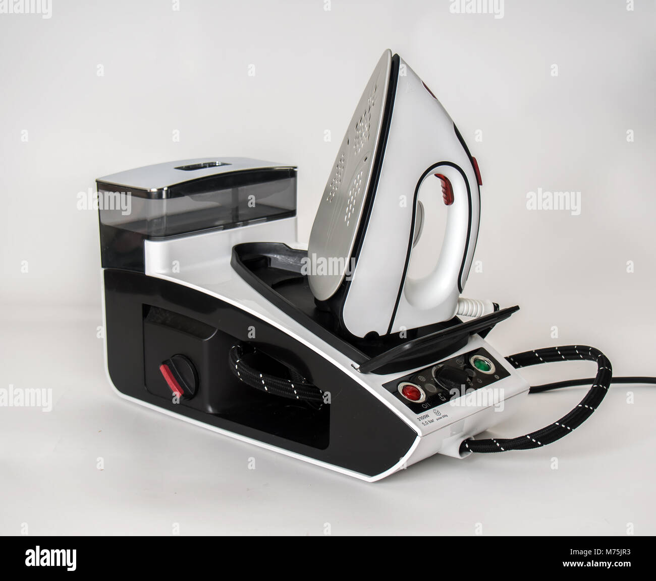 Steam generator for ironing of clean linen Stock Photo - Alamy