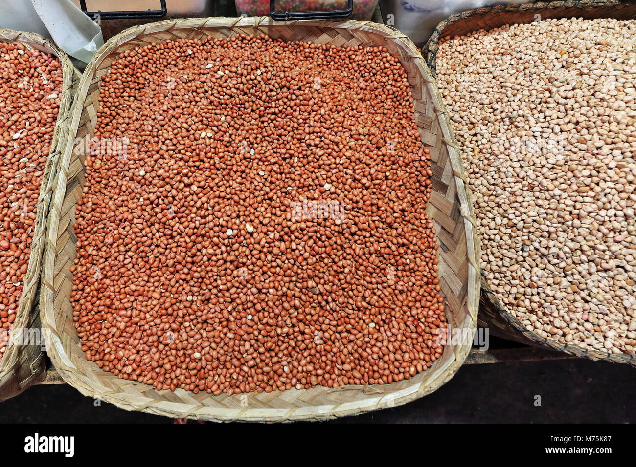 Roasted Filipino peanuts both with and without brown seed coat in woven ...
