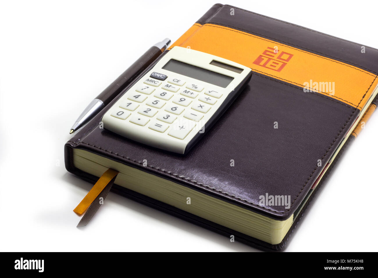 planner with pen and calculator on the table Stock Photo - Alamy