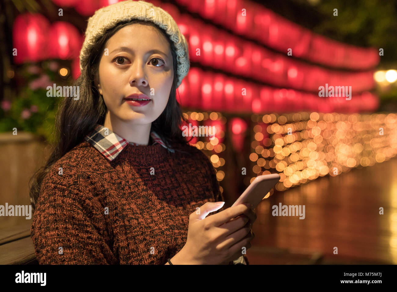 beautiful girl texting message to friends on traveling time at night ...