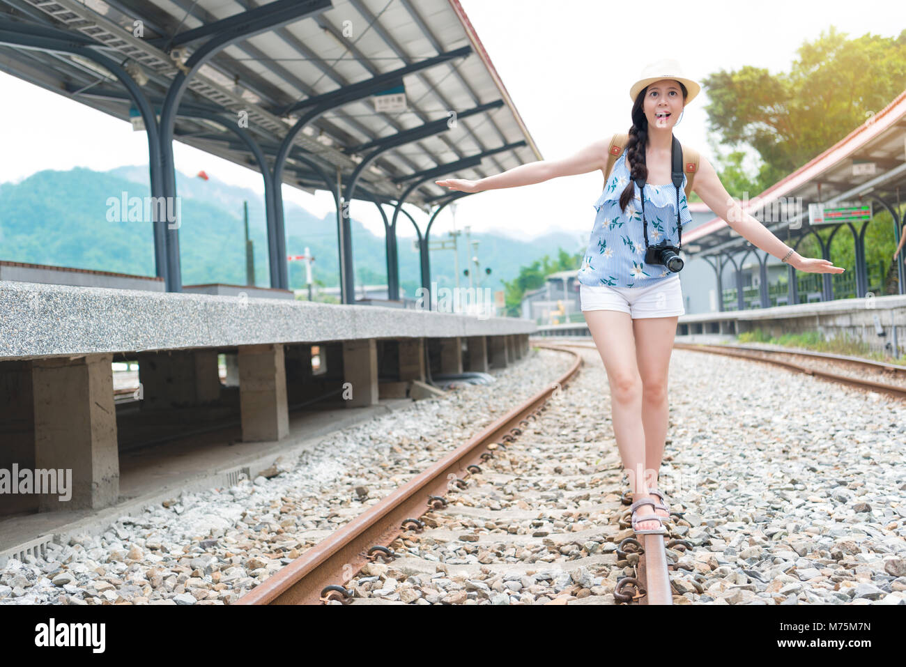 Beautiful girl on train tracks hi-res stock photography and images - Alamy
