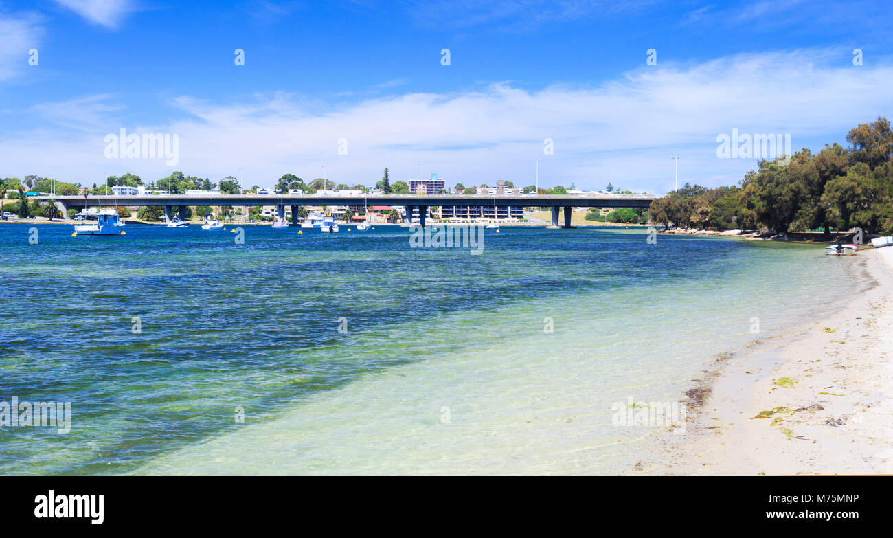 Beach beside the Swan River in North Fremantle with Stirling Bridge and ...