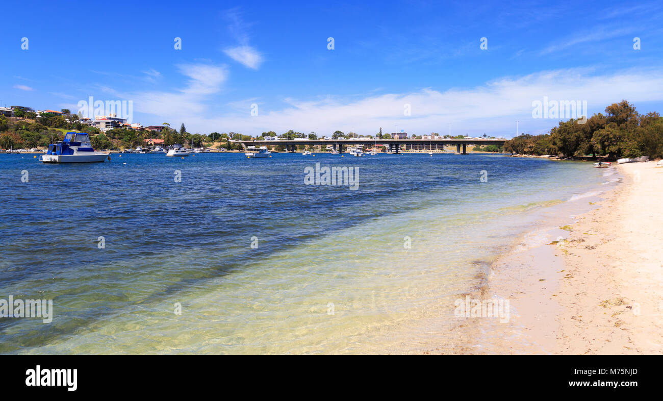 Beach beside the Swan River in North Fremantle with Stirling Bridge and ...