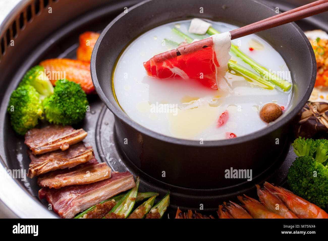 Barbecue and hot pot together Stock Photo - Alamy