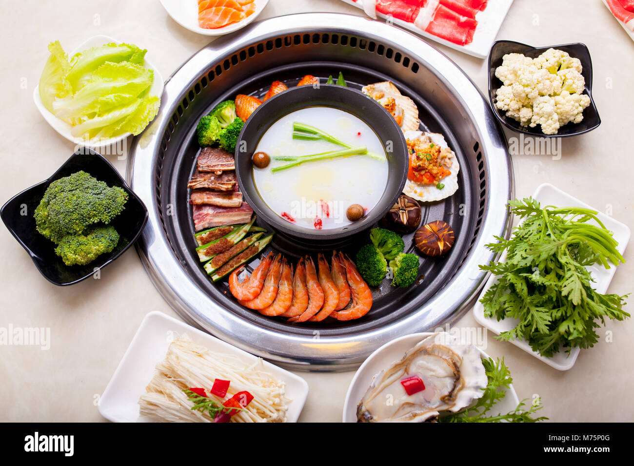 Barbecue and hot pot together Stock Photo - Alamy