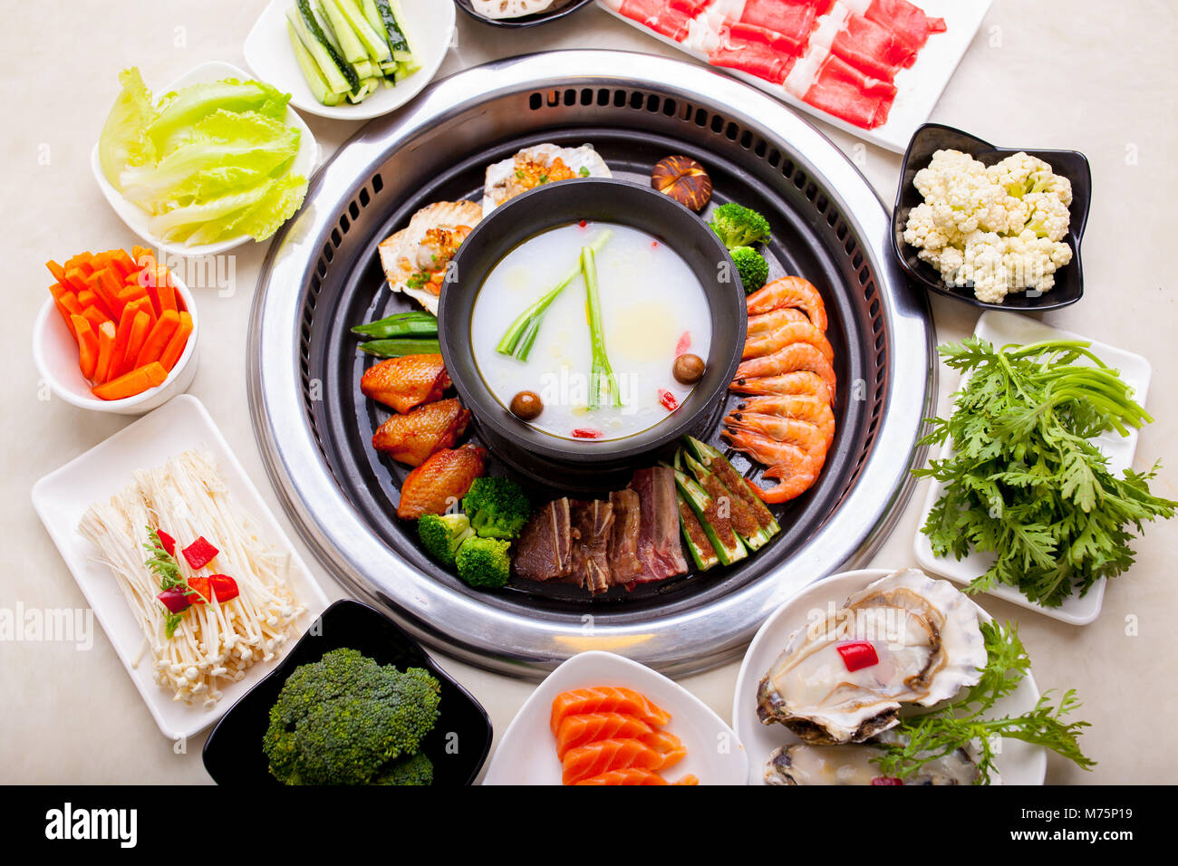 Barbecue and hot pot together Stock Photo - Alamy