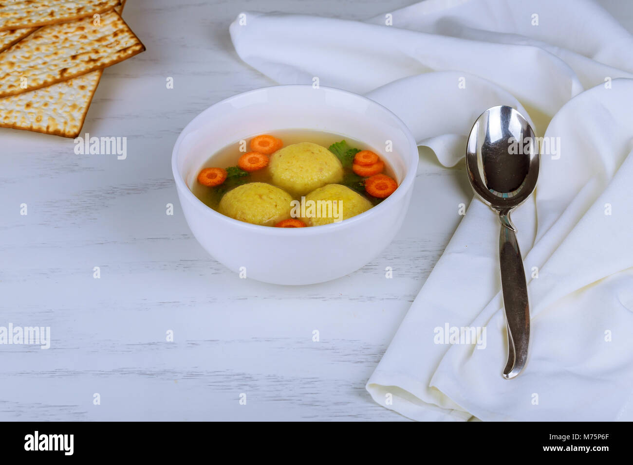 Traditional Jewish Matzah balls in a pot of soup during the Jewish ...