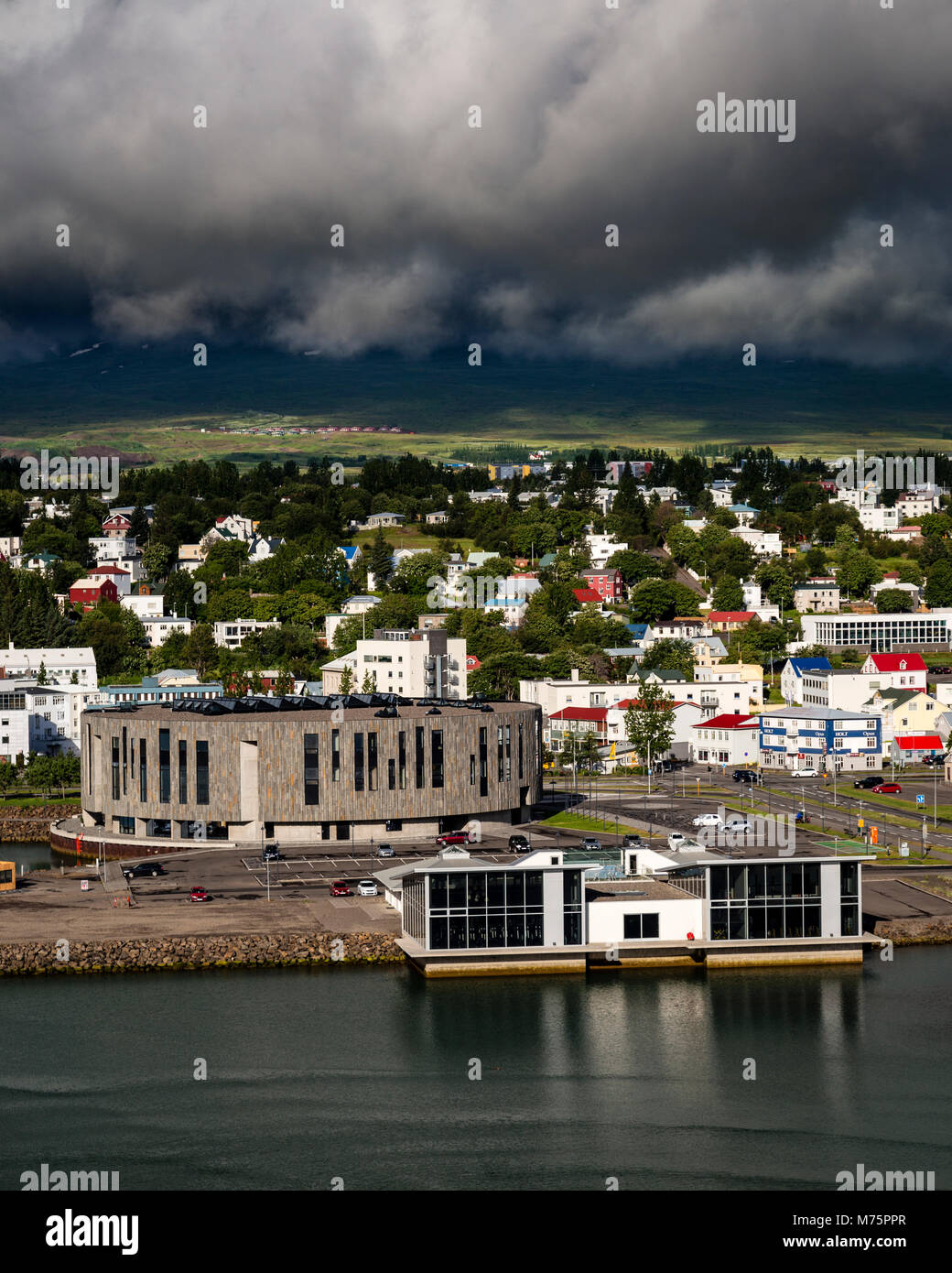 Waterfront at Akureyri, Iceland, with clouds and sunshine Stock Photo ...