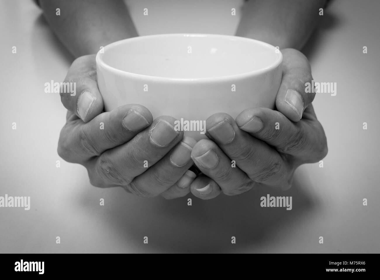 Begging bowl hi-res stock photography and images - Alamy