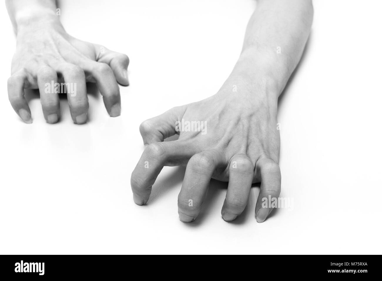 Hands crawling on white surface feeling pain and danger Stock Photo - Alamy
