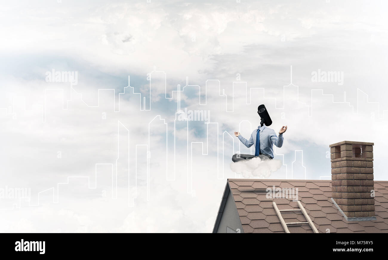 Faceless businessman with camera zoom instead of head sitting in lotus ...