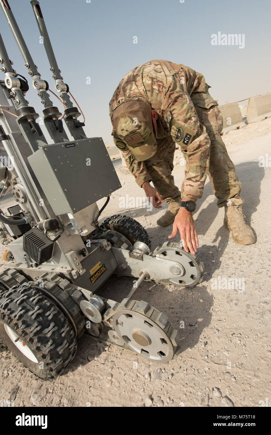 An F6B robot is utilized by members of the 379th Expeditionary Civil ...