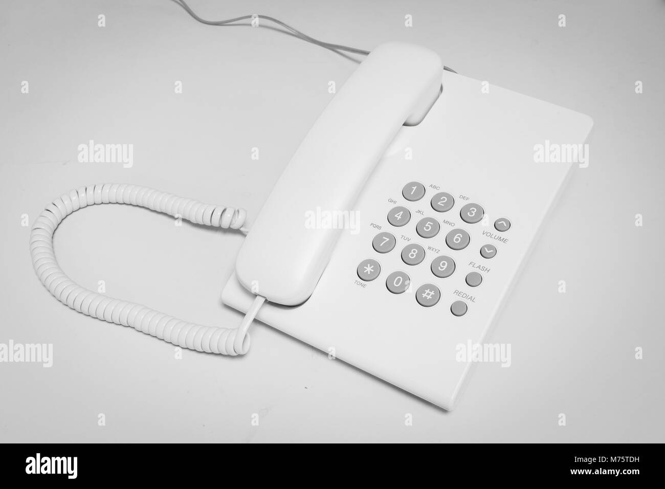 Line white telephone on white table for office usage Stock Photo - Alamy