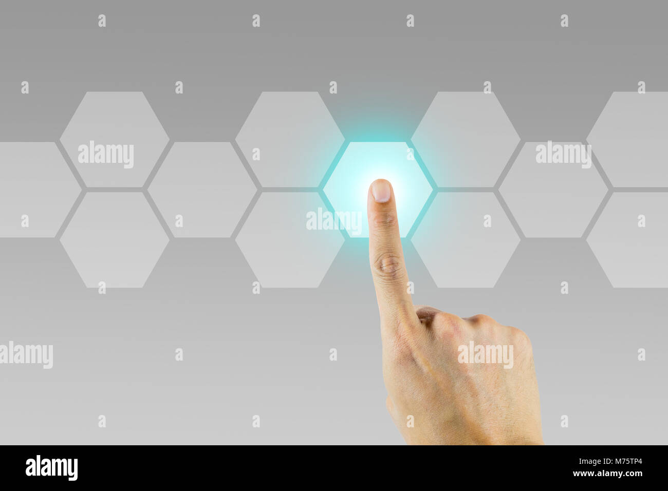 Hand pushing one of many hexagonal button to start/stop or choose a ...