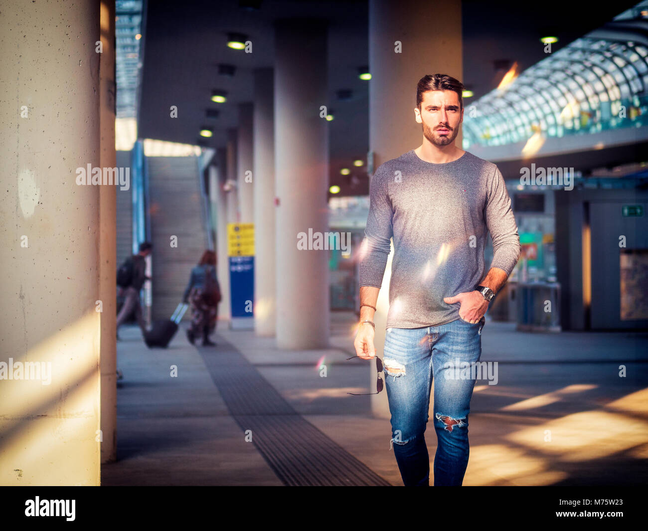 Handsome young man in modern building Stock Photo - Alamy