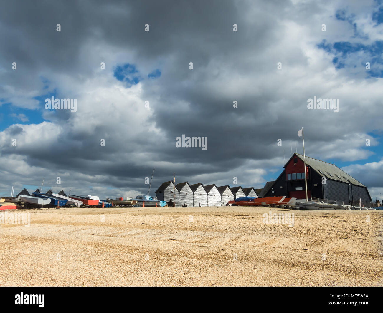 dramatic cloudscape over the beach in Whitstable, looking from the sand ...